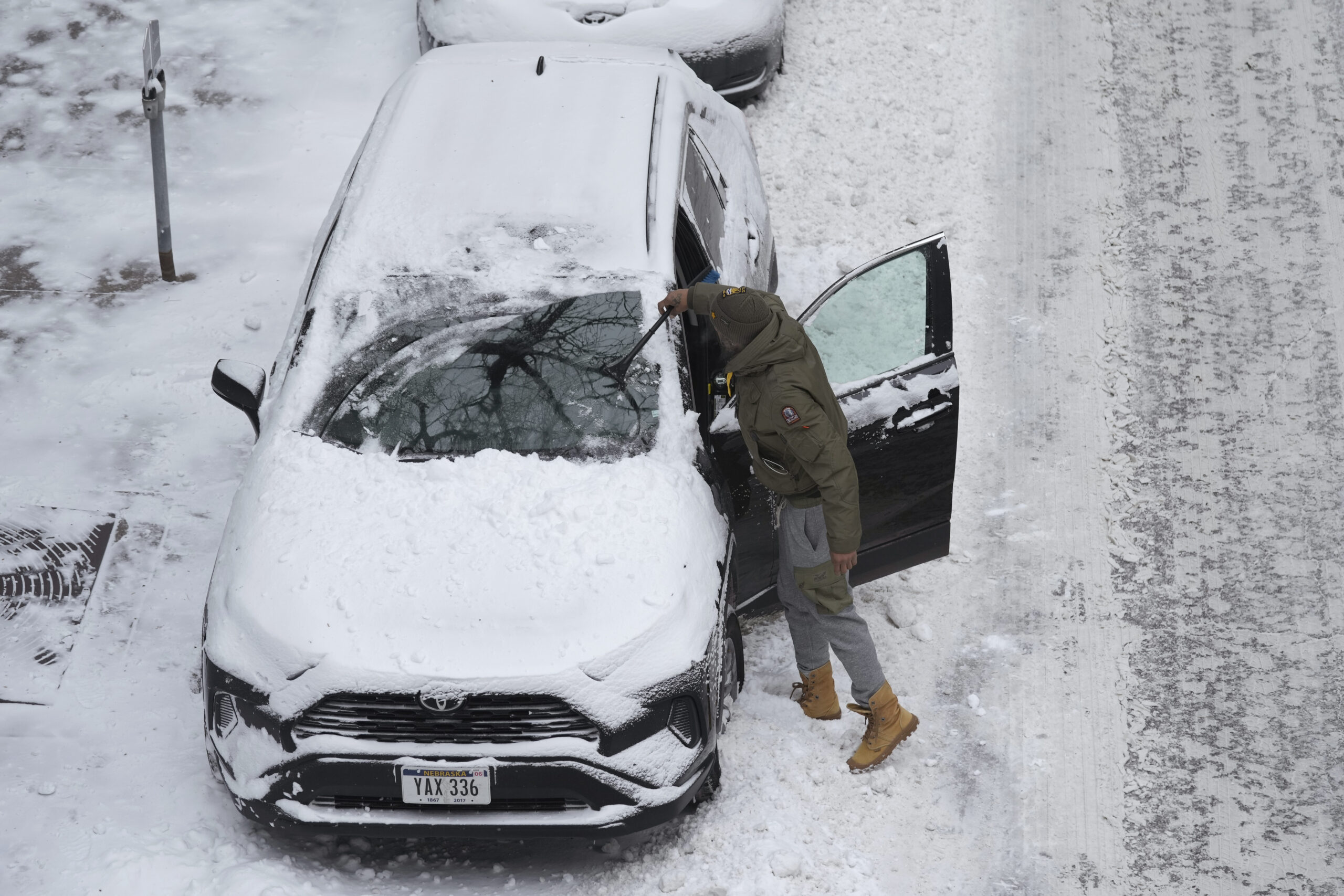 You're Not Supposed to Kick Ice Chunks Off Your Car? - 95-7 THE ROCK